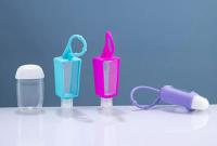 China Pet 30Ml Silicone Sleeve Empty Keychain Bottles Smooth For Hand Santizer for sale