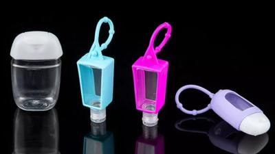 China Pet 30Ml Silicone Sleeve Empty Keychain Bottles Smooth For Hand Santizer for sale