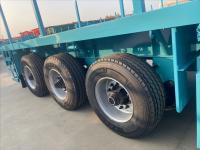 China CIMC's latest design of high-strength three-axle flat semi-trailer with column for sale