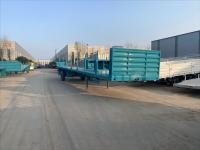 China 3 Axles Heavy-Duty Fatbed Semi Trailer for sale in Africa: Designed for Stable and Efficient Transportation of Oversized Loads for sale