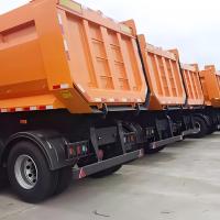 China Orange red or blue 3 axle with Leaf Spring Landing Gear King Pin tool box modern transport rear dump tipper dumper semi trailer for sale
