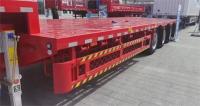 China CIMC 3 axles 40ft 12500*2500*1500mm 70 ton capacity 8-12 sets twist lock Flatbed deck truck tractor Semi Trailer for sale
