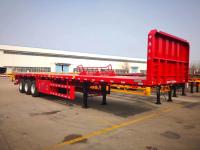China CIMC 3 axles 40ft 12500*2500*1500mm 70 ton capacity 8-12 sets twist lock Flatbed deck truck tractor Semi Trailer for sale