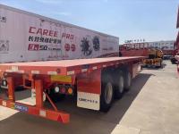 China CIMC cheap 2/3/4 axles Steel Cargo Hot Sale 20ft 40ft Container Chassis with lock Low Flat Deck transport Flatbed Semi Trailer for sale