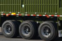 China CIMC 12400*2500*2000mm Curb weight 7T 12.4M 3 Axle 10pcs leaf spring 19T single action outrigger 40T payload Stake Semi Trailer for sale
