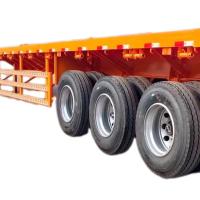 China 4-Axle Flatbed Shipping Container Semi Trailer With Nice Twistlocks Utility Steel Flatbed Semi Trailer for sale