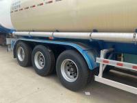 China The latest process design of CIMC is a three-axis liquid medium semi-trailer made of high-strength steel. for sale