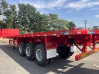 China 40ft Shipping Container 3 Axles 60 Tons Heavy-duty Transport Flatbed Semi Trailer for sale