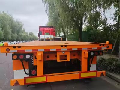 China Double Axles Iron Texture Length From 10m To 20m Heavy Duty Low Flatbed Transport Truck Semi Trailer for sale