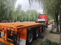 China Double Axles Iron Texture Length From 10m To 20m Heavy Duty Low Flatbed Transport Truck Semi Trailer for sale