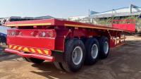 China China 3 Axle 20ft 40ft Container Trailer Cargo Flat Bed Flatbed Semi Trailer With Container Lock for sale
