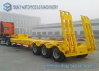 China 3 Axle 100 Ton Low Bed Semi Trailer Heavy Duty Flatbed Trailer With Manual Ramp for sale