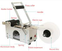 China Semi Automatic Packaging Labeling Machine , Small Bottle Labeler For Round Bottles for sale