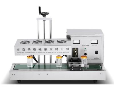 China Tabletop Automatic Vertical Sealing Machine For Cosmetic Glass Jars Aluminium Foil for sale