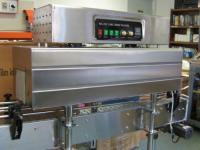 China Semi Automatic Bottle Cap Plastic Film Shrink Wrap Machine for sale