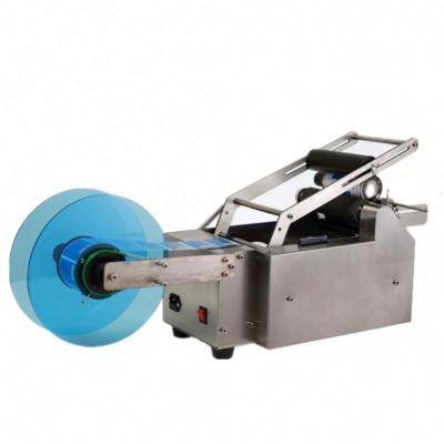 China Labeling Machinery Sticker Machines Simple Manual Handy Round Bottle Labeling Machine, Manual Labeler for sale