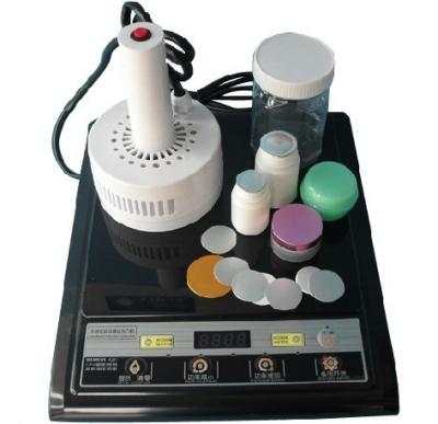 China Manual Electric Magnetic Induction Sealer Sealing Machine for Plastic Bottle Glass Jars for sale