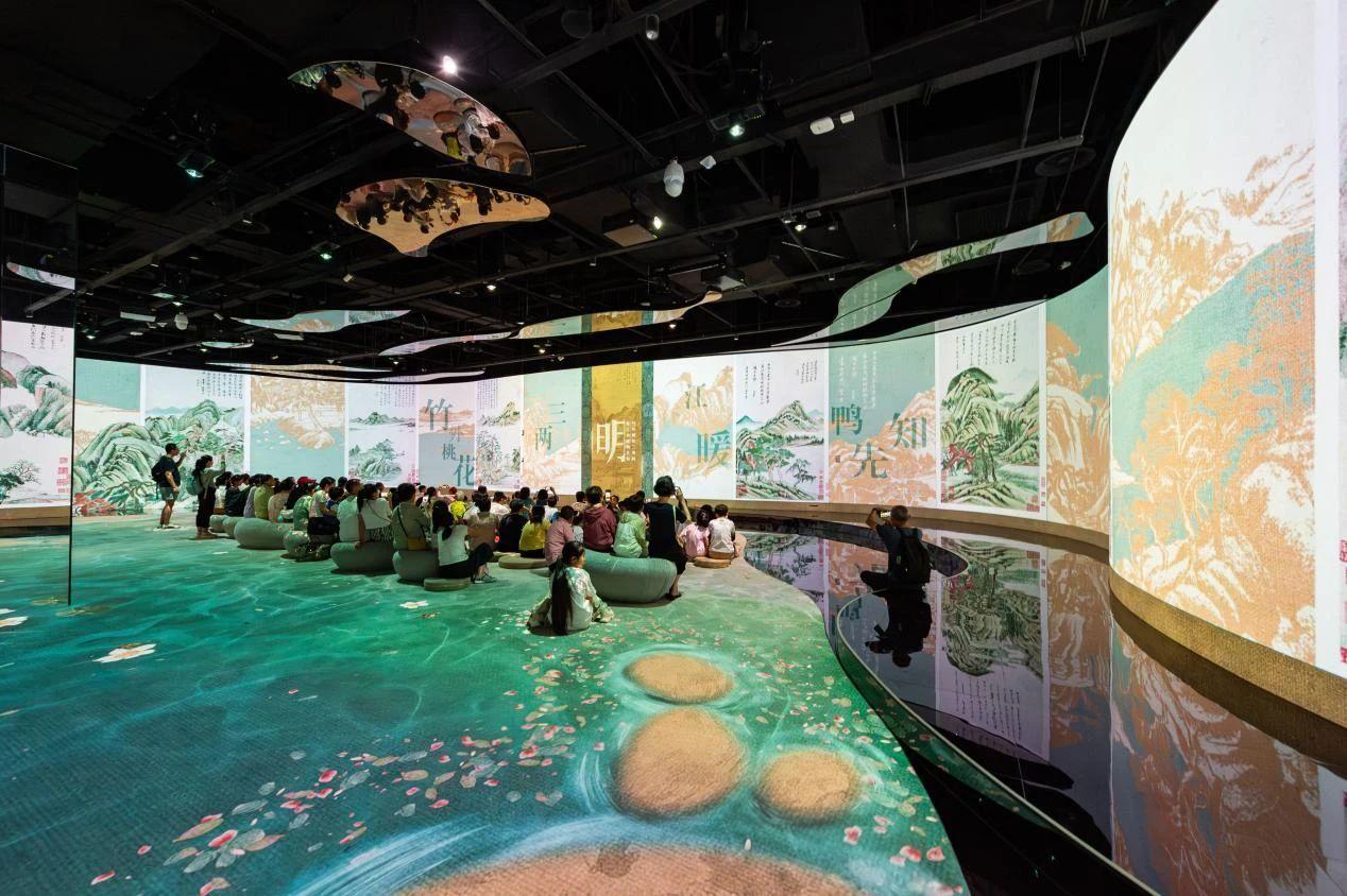 Visitors experiencing the immersive digital exhibition space