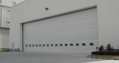China strength Industrial Fabric Vertical Lift Fabric Doors Featuring Maximumheight 12 Meters and Windresistance Up To 120 Kmh Ideal for Warehouses for sale