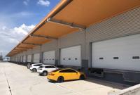 China Warehouse Logistics Vertical Lift Sectional Door Hot Dip Galvanized Steel 40mm for sale