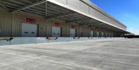 China Wind Resistance 450N/m2 Industrial Sectional Doors Garage Insulated Steel Doors for sale