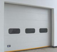 China Fast Lifting Sectional Industrial Door 380V Motor 26DB Sound Insulation for sale