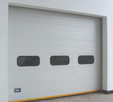 China Fast Lifting Sectional Industrial Door 380V Motor 26DB Sound Insulation for sale