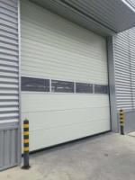 China 40mm Thickness Wind-Resistant CE Certified Industrial Sectional Lift Door with Remote Control for sale