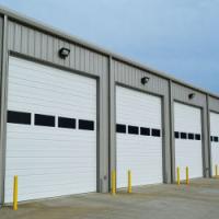 China 40mm Thickness Industrial Sectional Door with AC 220V-240V Motor and 24dB Acoustic Insulation for sale