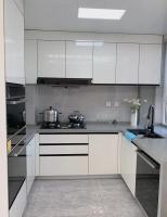 China Customized Free Design PVC Glossy Kitchen Cabinet For Apartment Villa for sale