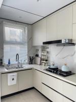 China Customized Free Design PVC Glossy Kitchen Cabinet For Apartment Villa for sale
