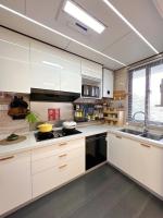 China Customized Free Design PVC Glossy Kitchen Cabinet For Apartment Villa for sale