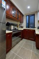 China Lacquer Cupboard Wood Veneer Finished Kitchen Cabinet With Island for sale