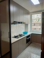 China Modern Design Melamine Finish With Quartz Stone Waterfall Island Kitchen Cabinet for sale