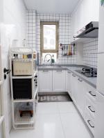 China Modern Design Melamine Finish With Quartz Stone Waterfall Island Kitchen Cabinet for sale