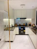 China Modern Design Melamine Finish With Quartz Stone Waterfall Island Kitchen Cabinet for sale
