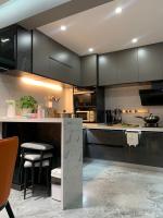 China Contemporary Modern Style Two Tone Slab Panel Dark Kitchen Cabinet for sale
