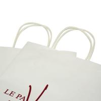 China Wine Branded Paper Bags White Kraft Bags With Handles Pantone 221C Printing for sale