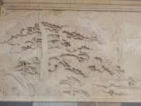 China Exquisite Custom Beige Sandstone Carvings Hand Carved Stone Wall Relief for sale