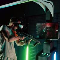 China Arcade VR Shooting Simulator VR Gun Battle Standing Walker VR Machine Gun Gatling for sale