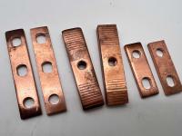 China Custom Copper Terminal Plates – Precision Stamped Electrical Busbar Contact Pads with Mounting Holes and Anti-Slip Grooves for sale