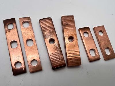 China Custom Copper Terminal Plates – Precision Stamped Electrical Busbar Contact Pads with Mounting Holes and Anti-Slip Grooves for sale