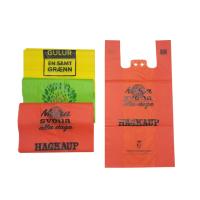 China Biodegradable Reusable T Shirt Bags Easy Tie Handle Singlet Checkout Bags Customized for sale