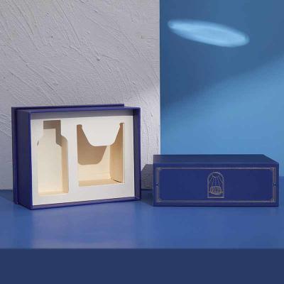 China Recyclable Luxury Blue Paper Shoulder Rigid Wine Packing Gift Box EVA Insert Hot Stamping for sale