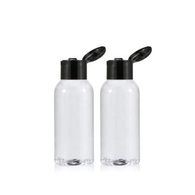 China Transparent Squeeze Type 100ml Flip Top Plastic Bottles With Black Caps for sale