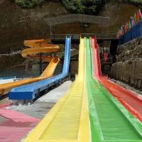 China Rainbow Water Slide 8m Height 65m Length Fiberglass Pool Slide for Amusement Parks with 500kg Capacity for sale