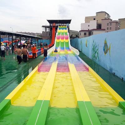 China 0.65m Inner Width Rainbow Water Slide with 65m Length and 180 Guests/Hour Capacity for Theme Parks for sale