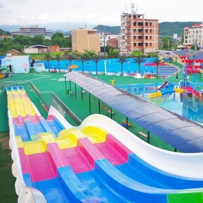 China Rainbow Wavy Water Slide 8m Height 65m Length Fiberglass Commercial Water Park Equipment for sale