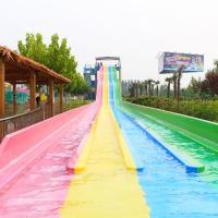 China Rainbow Water Slide 8m Height 65m Length Fiberglass Aquatic Slide for Amusement Parks with 500kg Capacity for sale