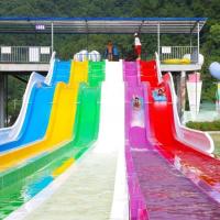 China Multi-Lane Rainbow Wavy Water Slide 65m Length × 3 Lanes with 180 Guests/Hour Capacity for Amusement Parks for sale